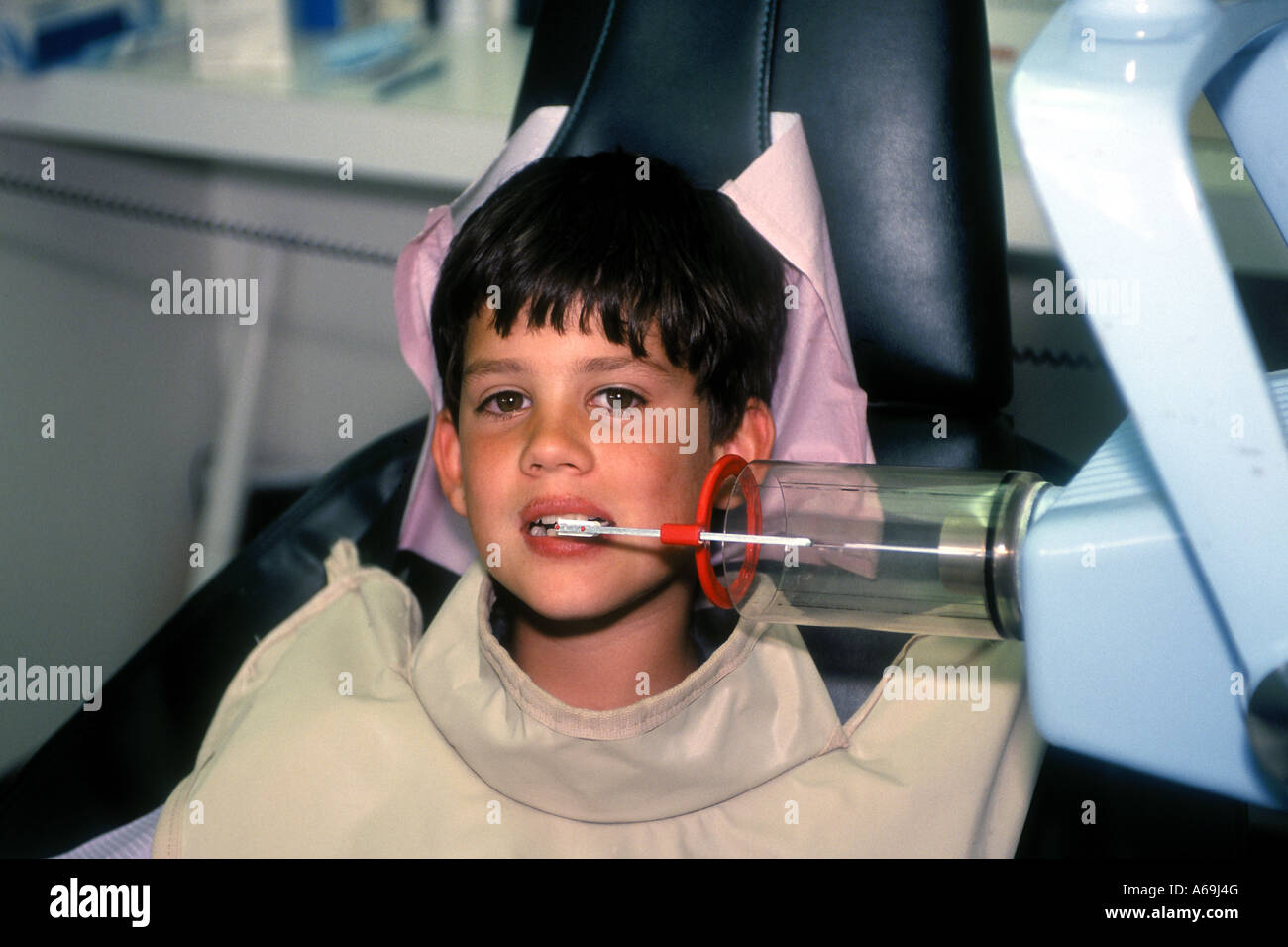 Young boy in dental office getting Xrayed Stock Photo - Alamy