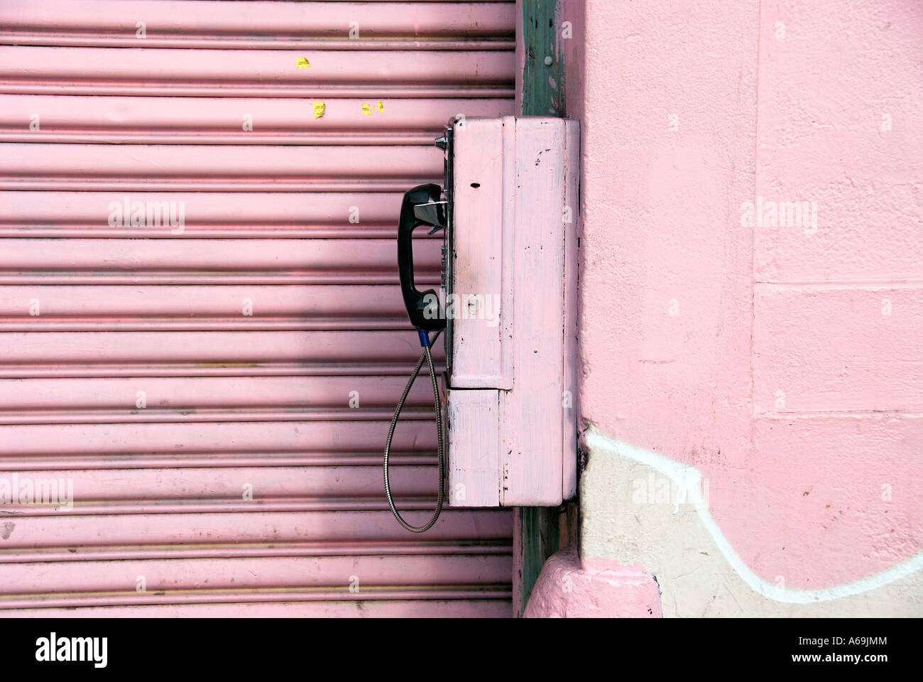 "Wall mounted "Public telephone", wall and door painted pink, USA Stock ...