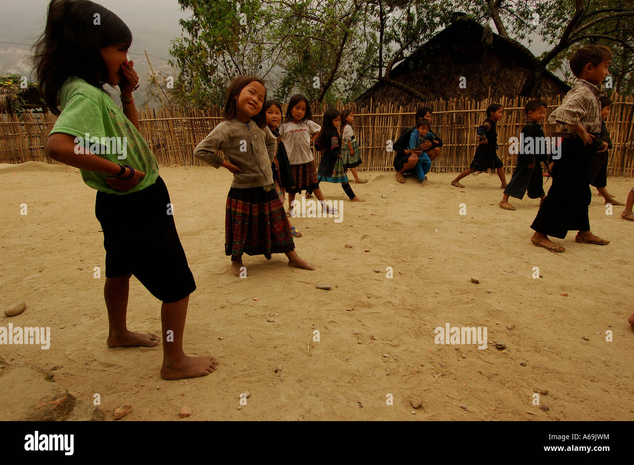 Young Black Hmong children in traditional cloth practice physical ...