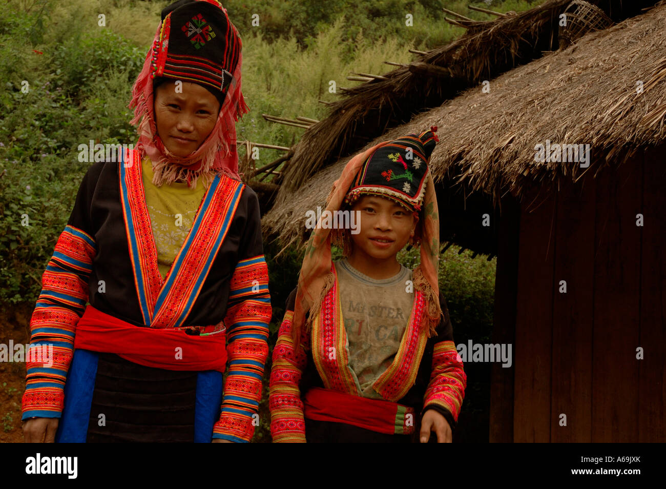 Blue Hmong indigenous mother and daughter wearing traditional cloth ...
