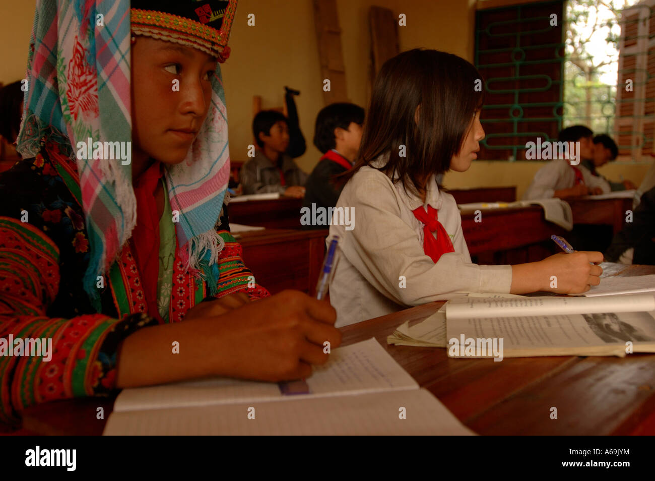 A Blue Hmong indigenous girl dressed in colorful traditional clothing ...