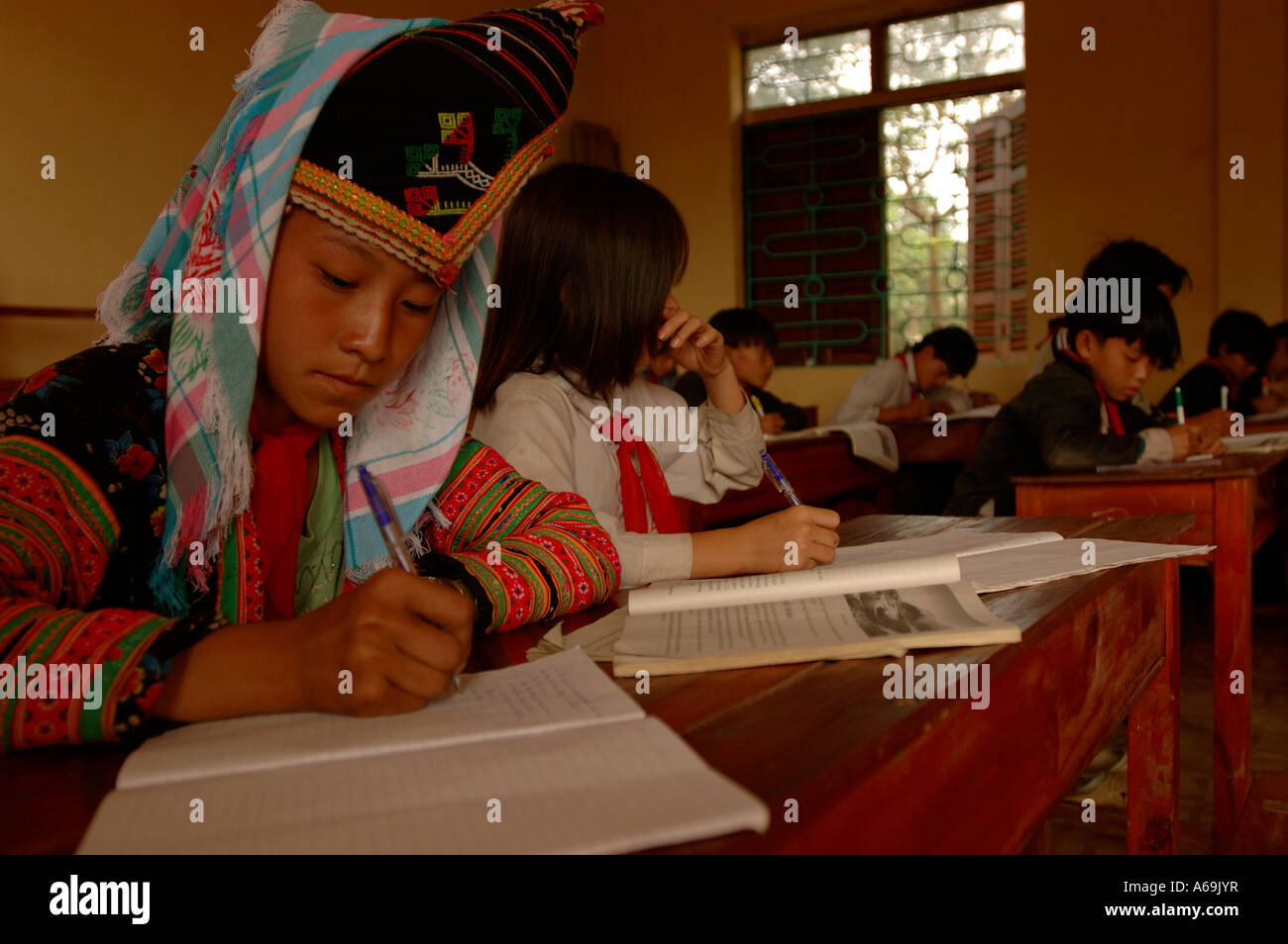 A Blue Hmong indigenous girl dressed in colorful traditional clothing ...