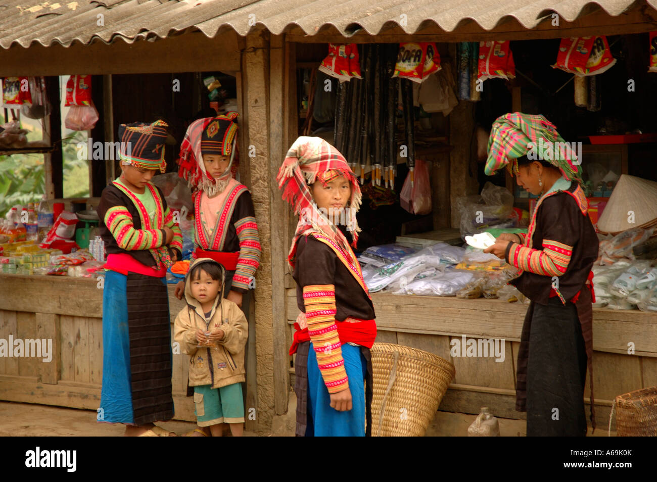 Blue Hmong women in traditional cloth check the new arrivals at the ...