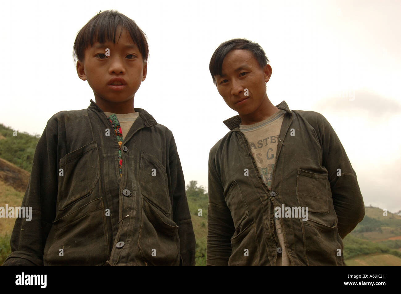 A Blue Hmong indigenous father and son proudly stand in their ...