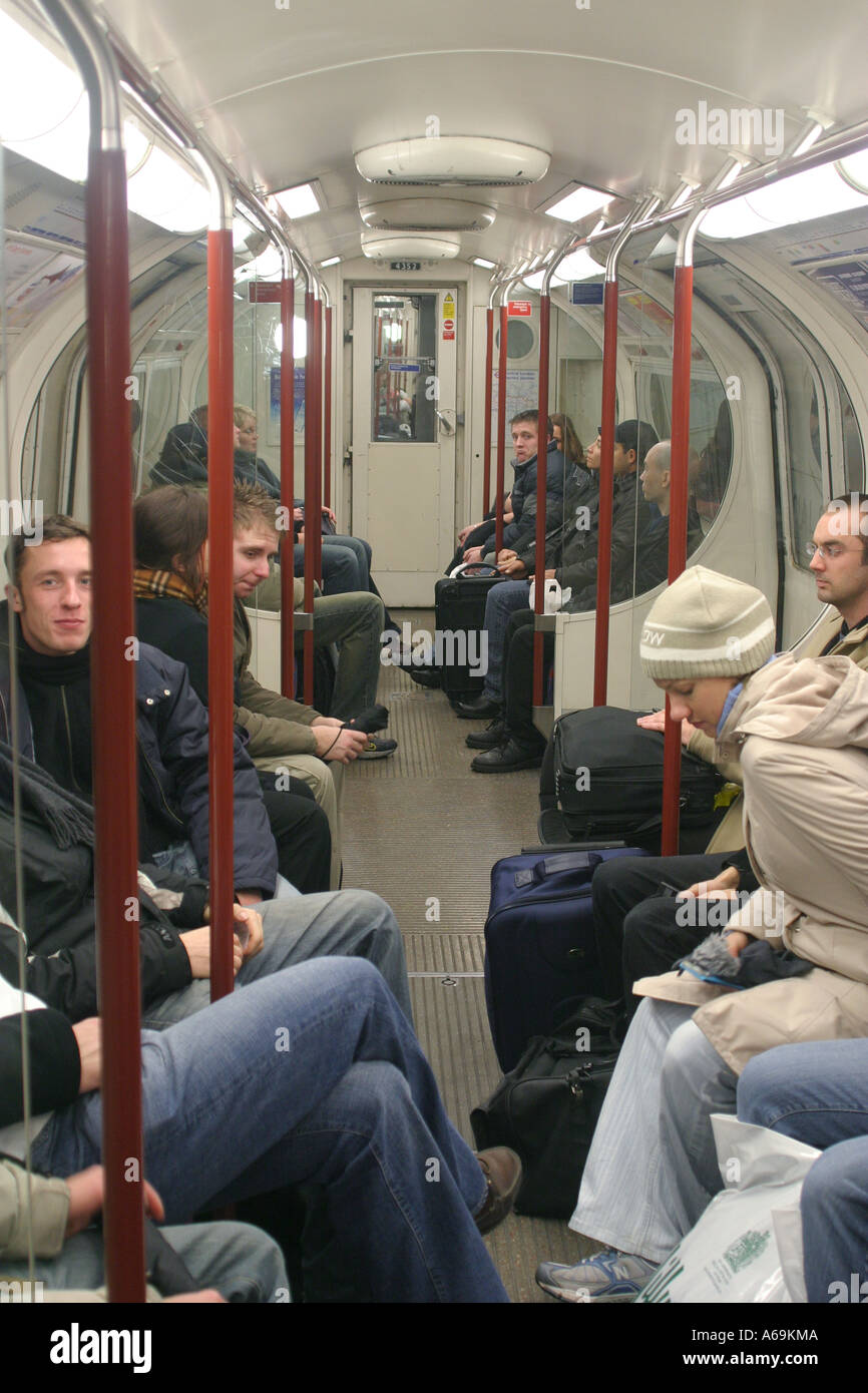 Passengers inside a subway train The Tube London UK Stock Photo - Alamy