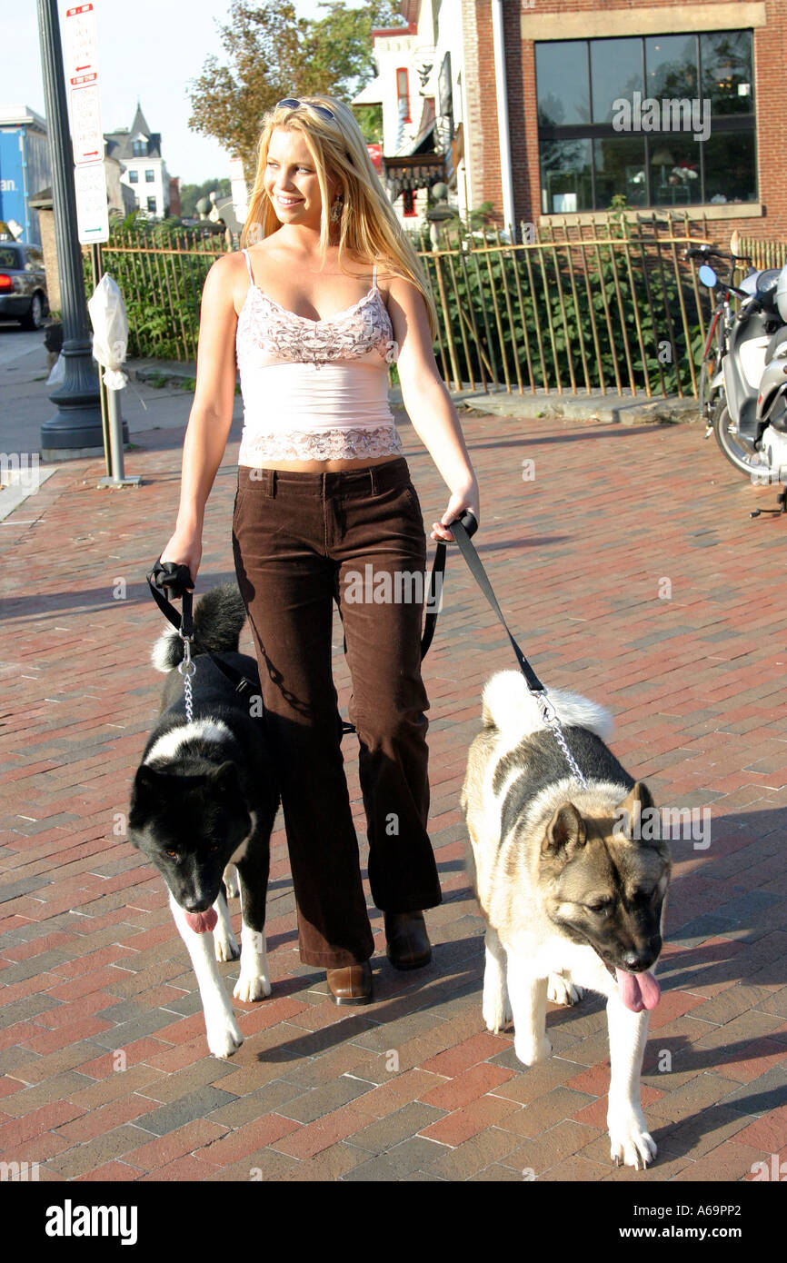 Sexy woman walking her two dogs Model Released Stock Photo - Alamy