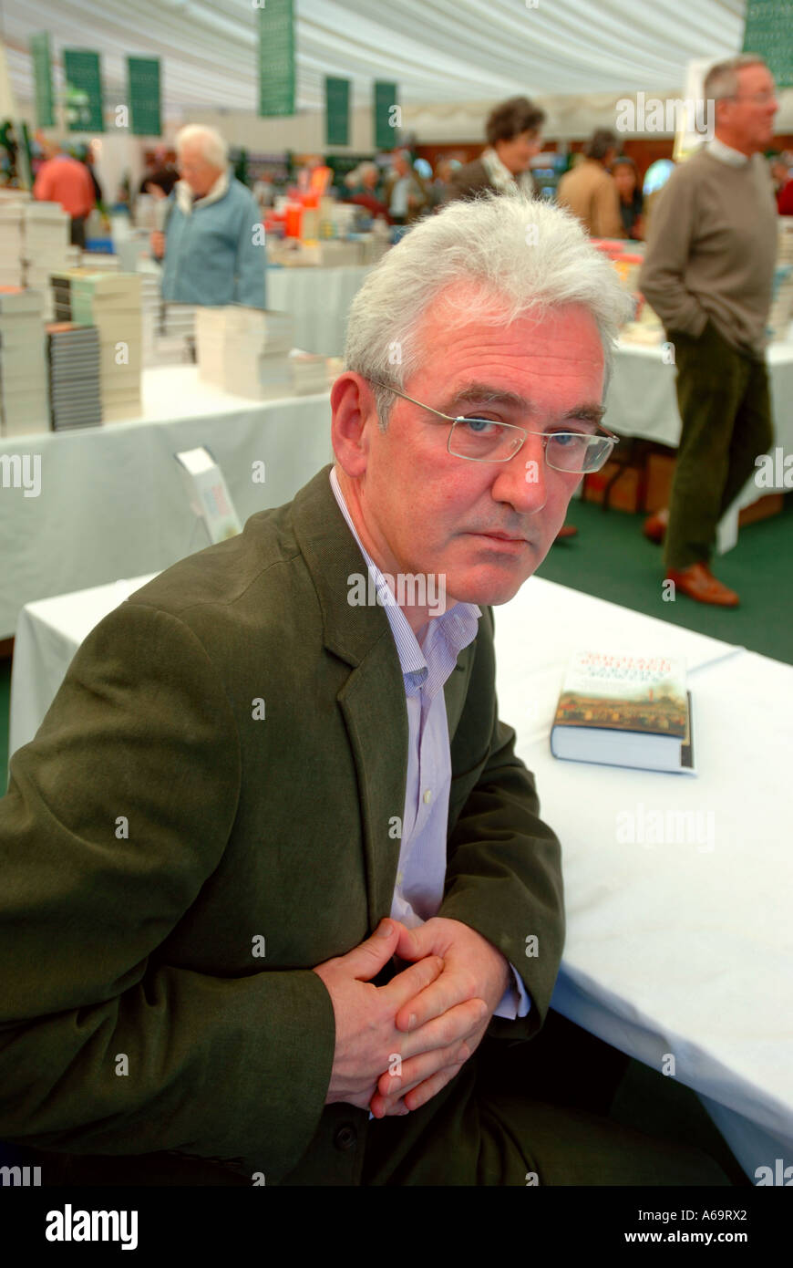 Signing copies of their book hi-res stock photography and images - Alamy