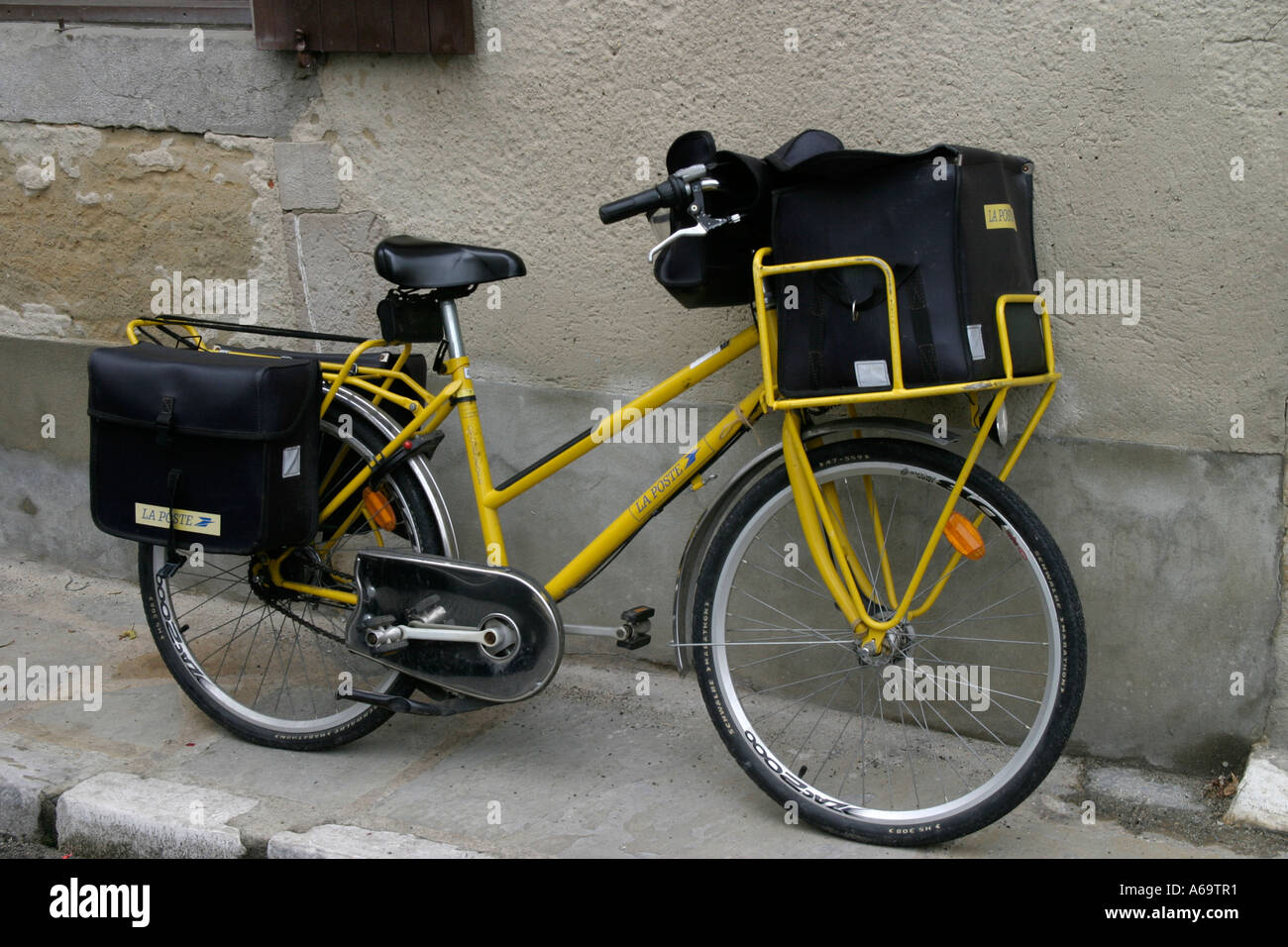 French postman's yellow bike Stock Photo - Alamy