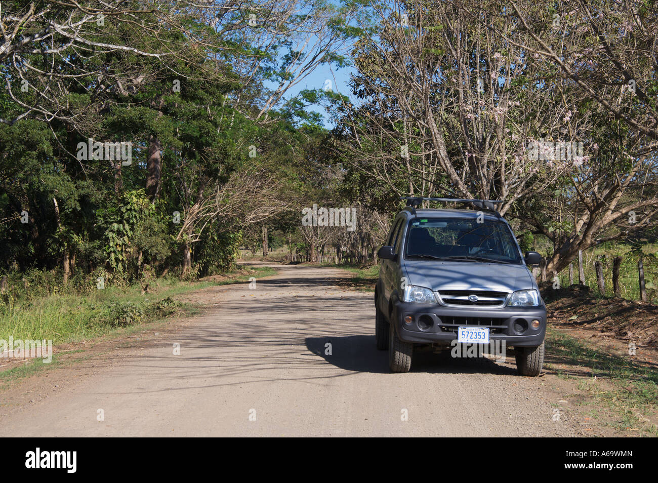 Car parked beside a dirt road in Costa Rica Stock Photo - Alamy