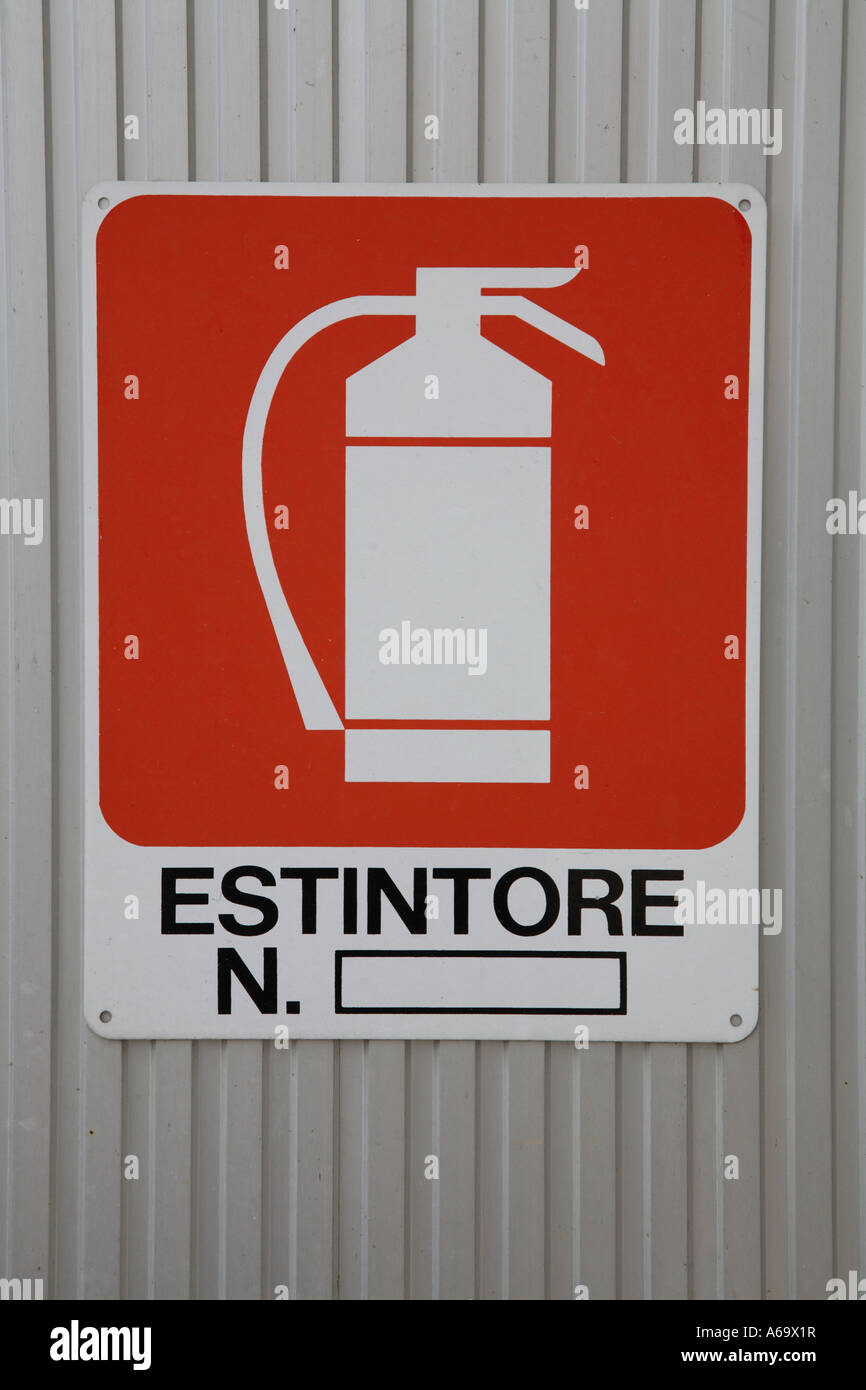 fire extinguisher signal on wall Stock Photo - Alamy