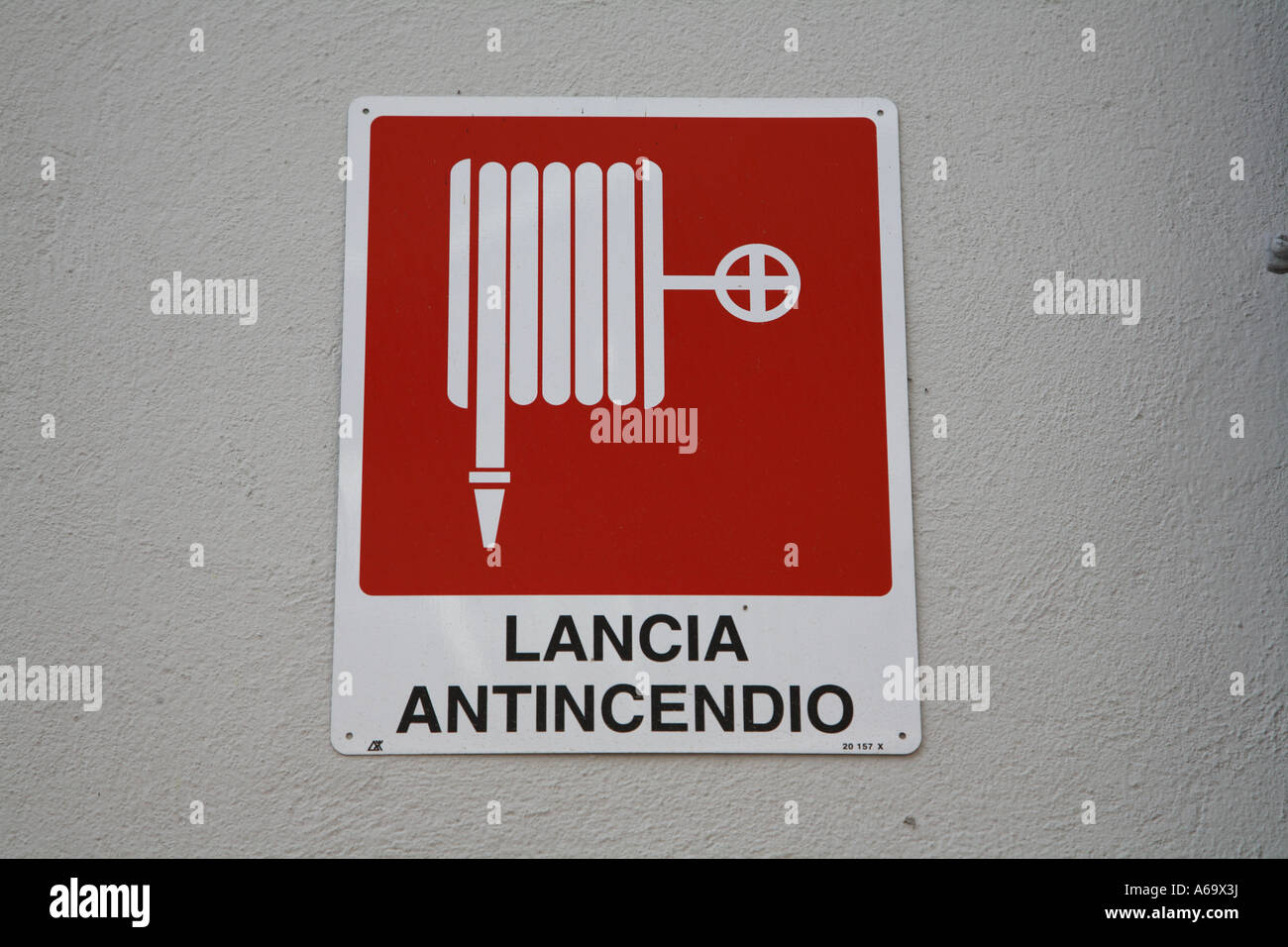 fire extinguisher signal on wall indicating the pumping water in case ...