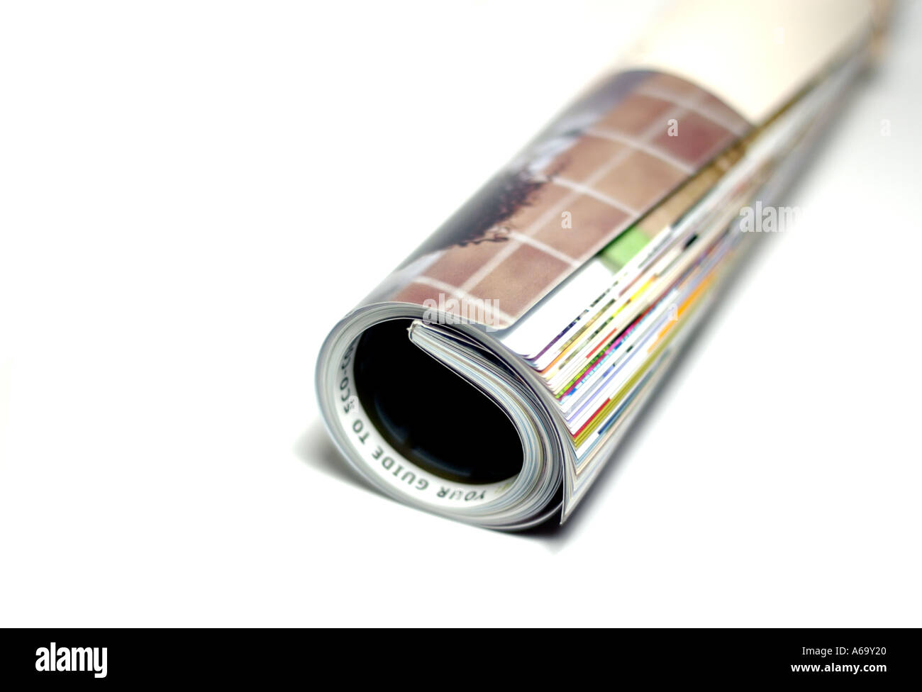 Rolled up magazine Stock Photo - Alamy