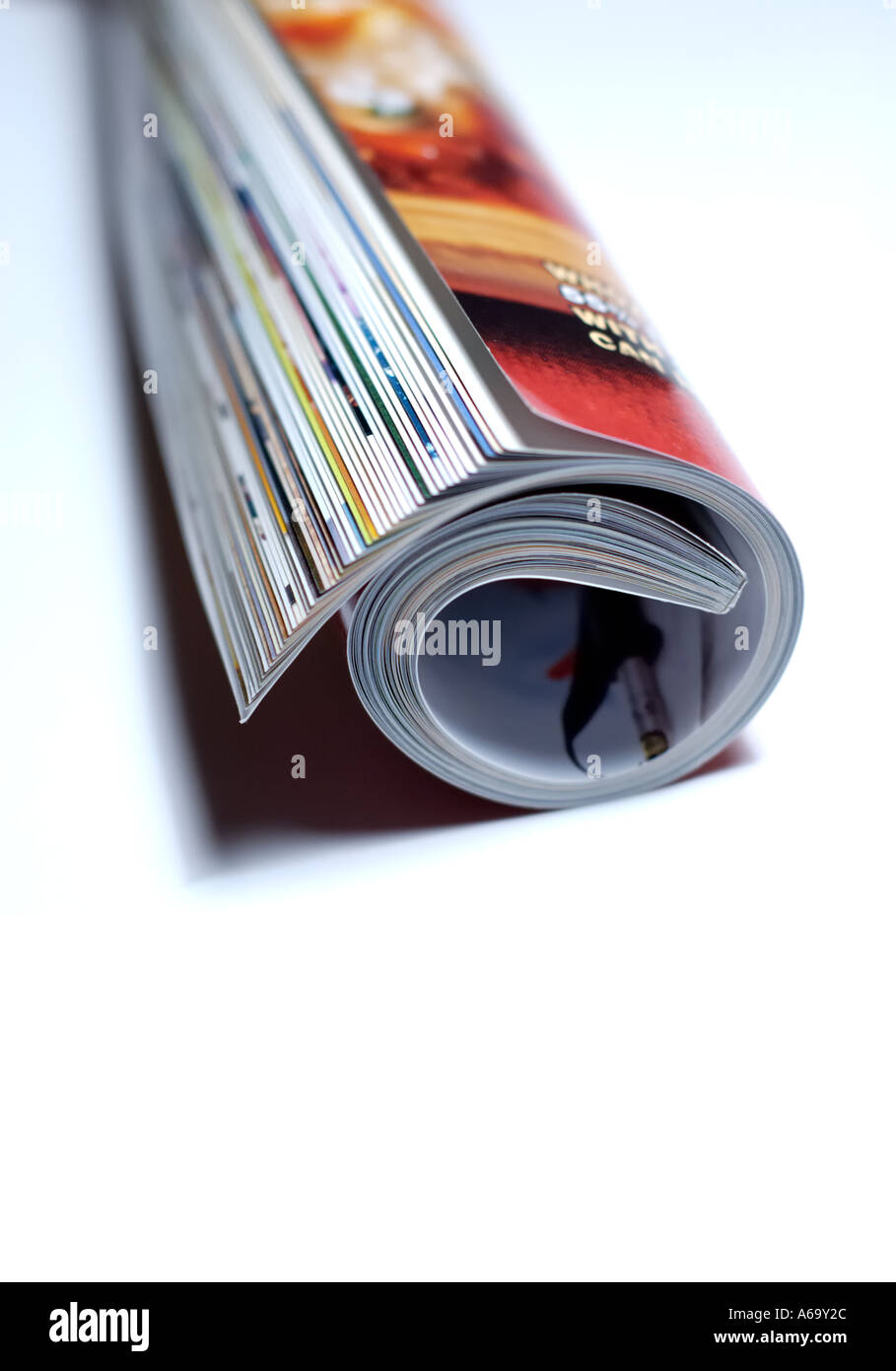 Rolled up magazine Stock Photo - Alamy
