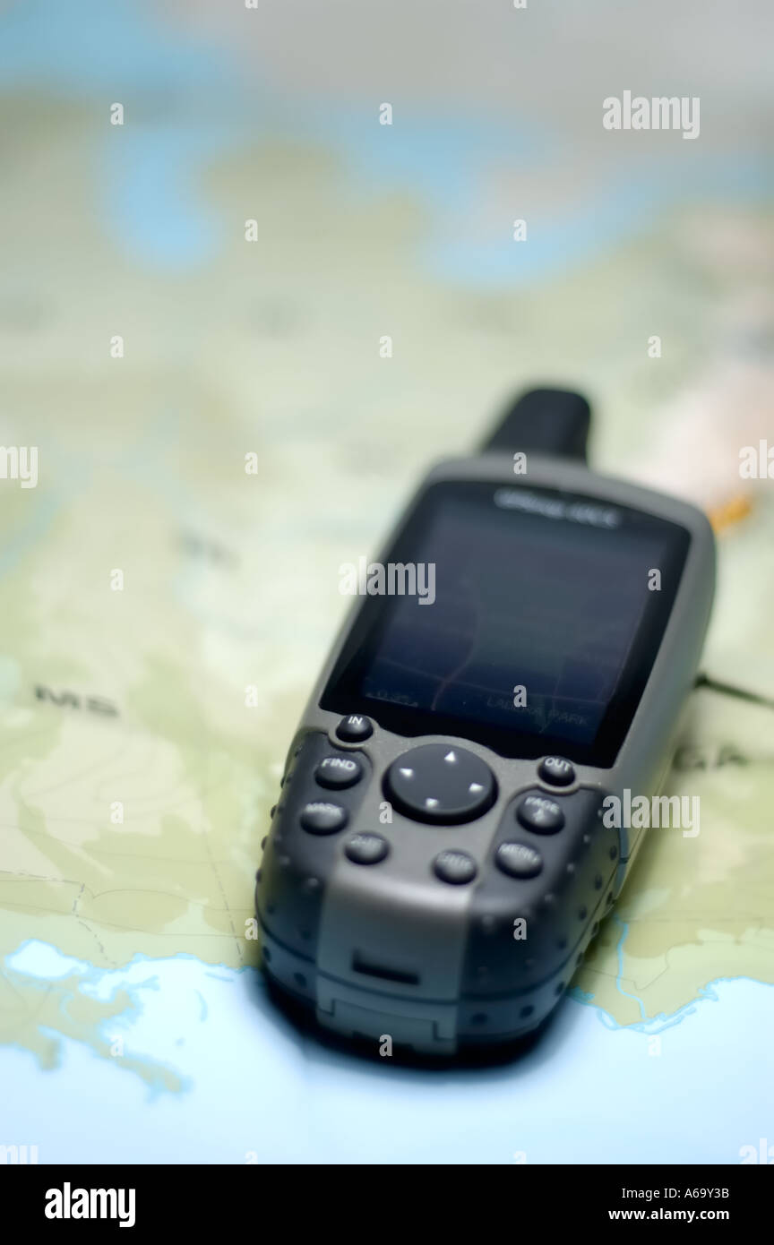 Still life of GPS laid out on a topo map Stock Photo - Alamy