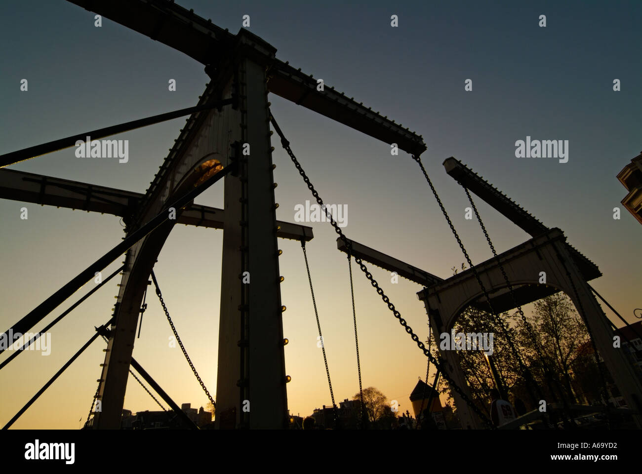 Silhouette of double drawbridge over nieuwe keizergracht canal ...