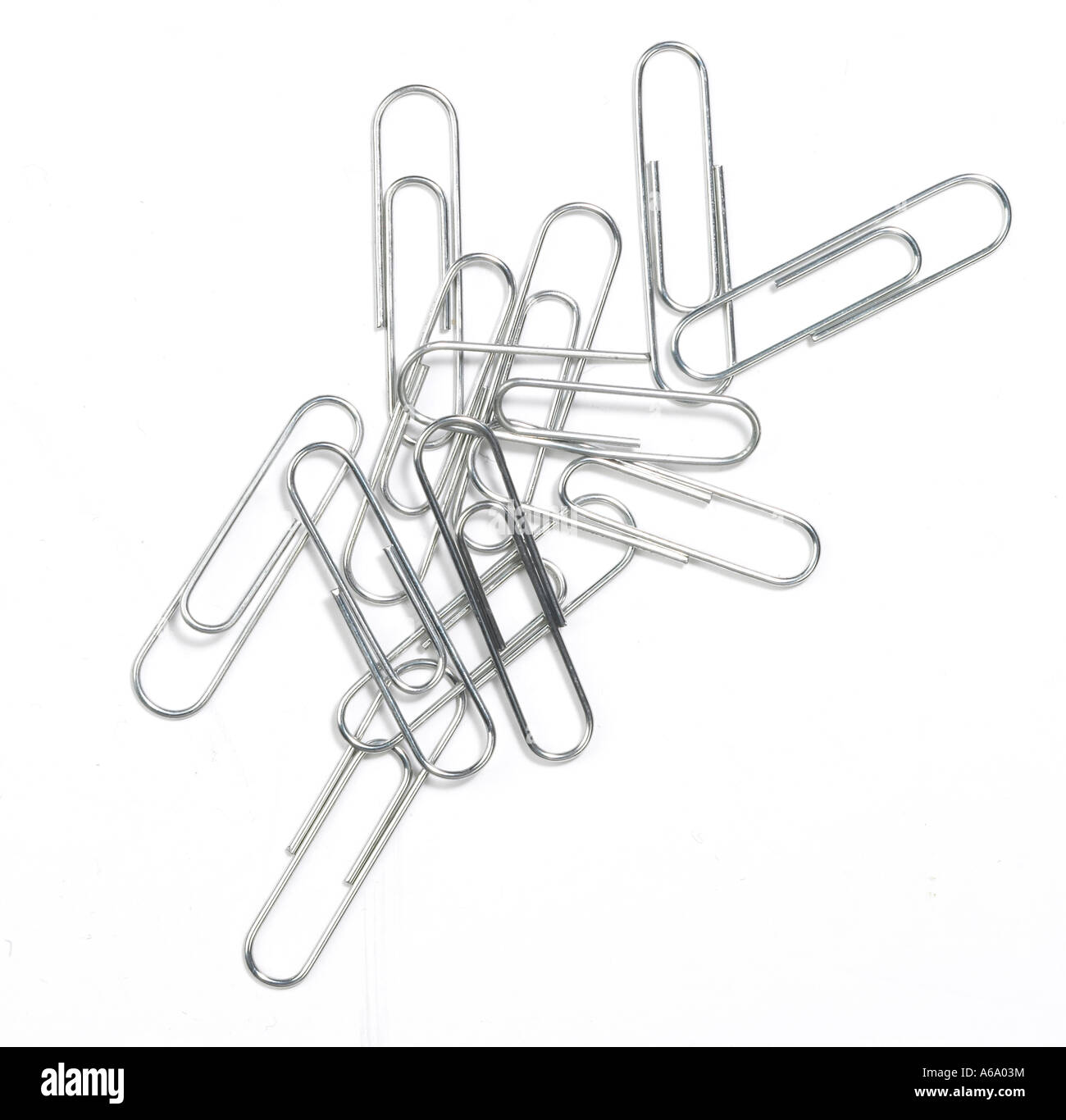 paper clips piled on each other on white Stock Photo - Alamy