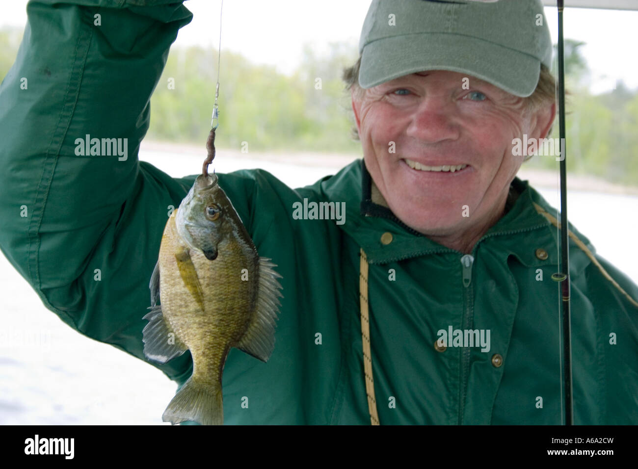 Happy fisherman displaying his sunfish catch at the annual rite of the ...