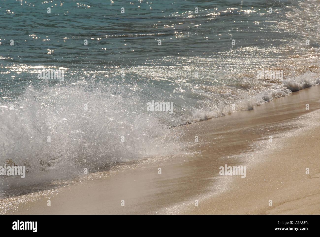 Breaking waves on a beach Stock Photo - Alamy