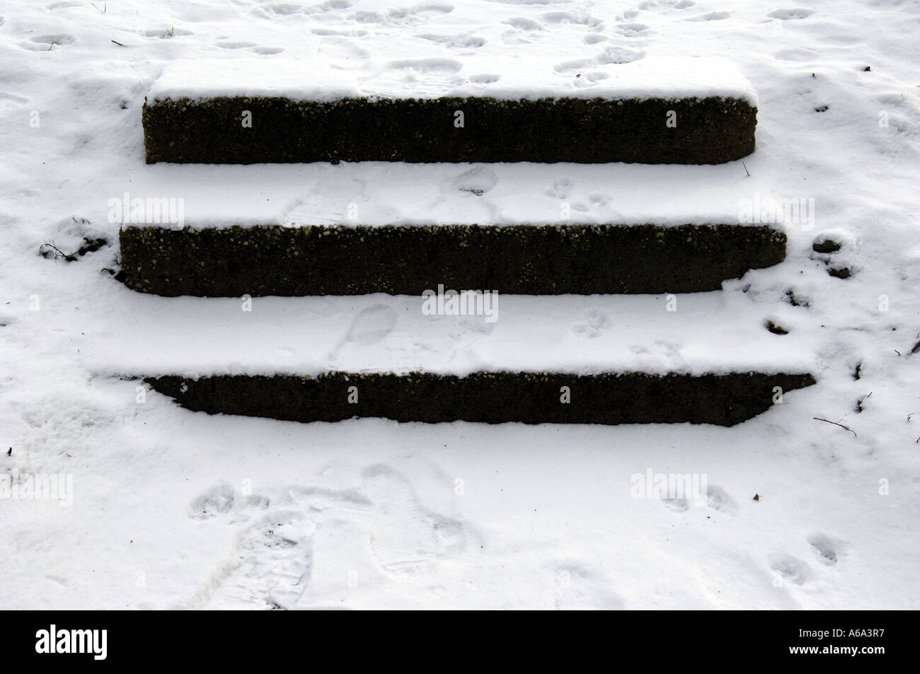 snow covered grid drain floor roadside road winter wintry ice cold ...