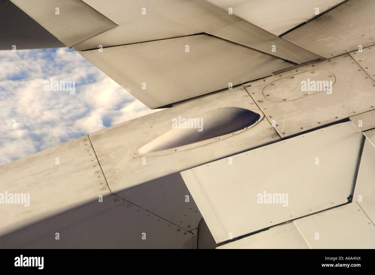 Detail of the (rather dirty) wing of a jetliner cruising above the ...