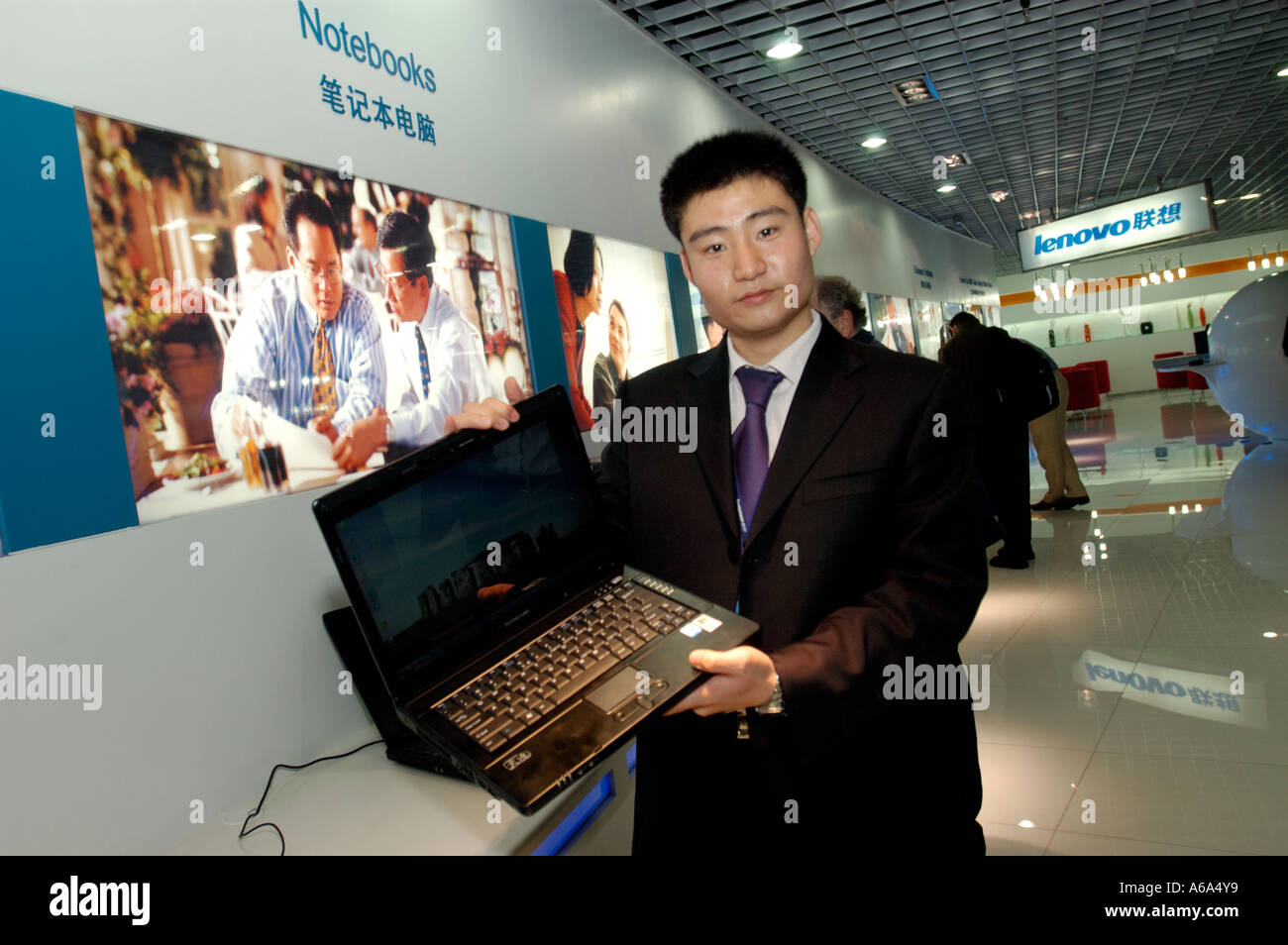 A Lenovo employee shows a Lenovo laptop at Lenovo Innovation Center in ...