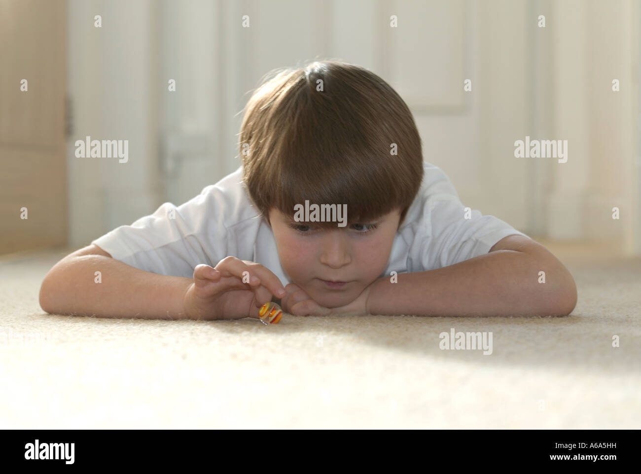 Boy playing marbles hi-res stock photography and images - Alamy