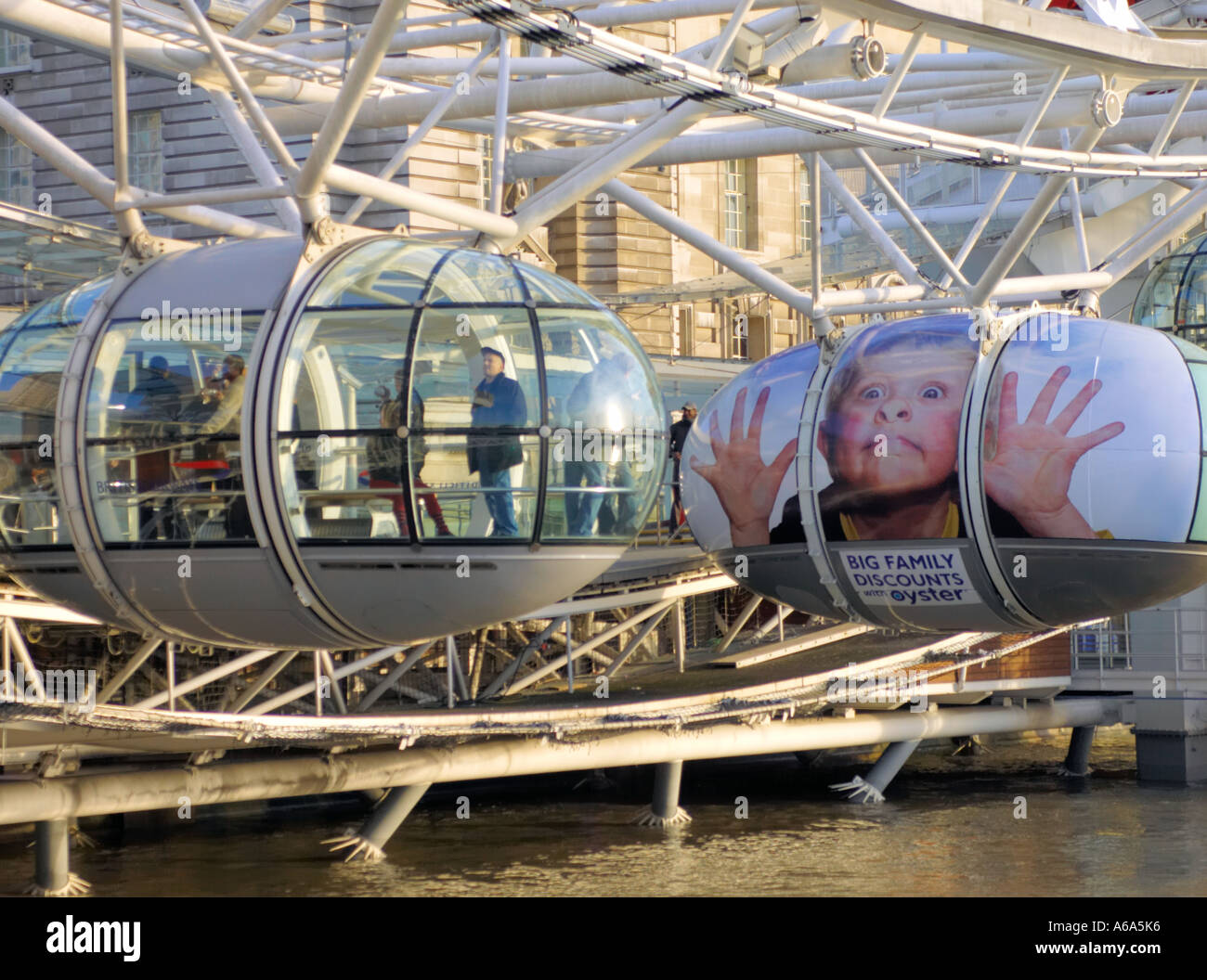 pods at the base of the London eye with humourous advertising for ...