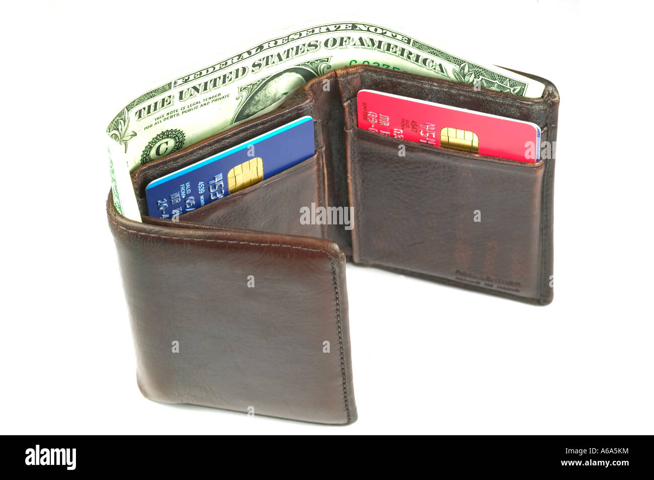Old brown leather wallet open with a dollar bill sticking out isolated ...