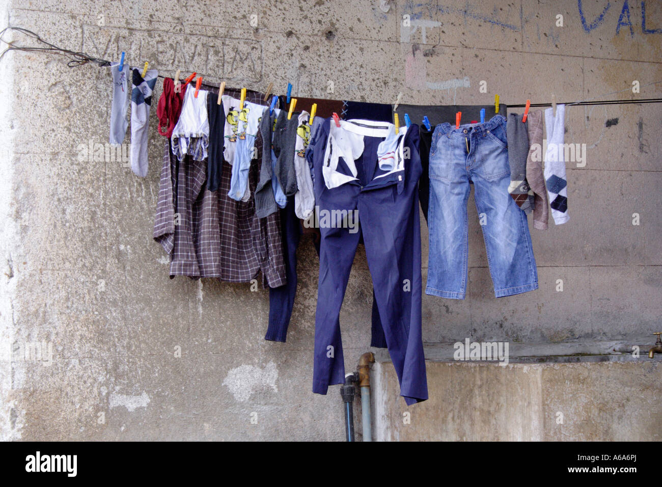clothes hanging on an inner city washing line Stock Photo - Alamy
