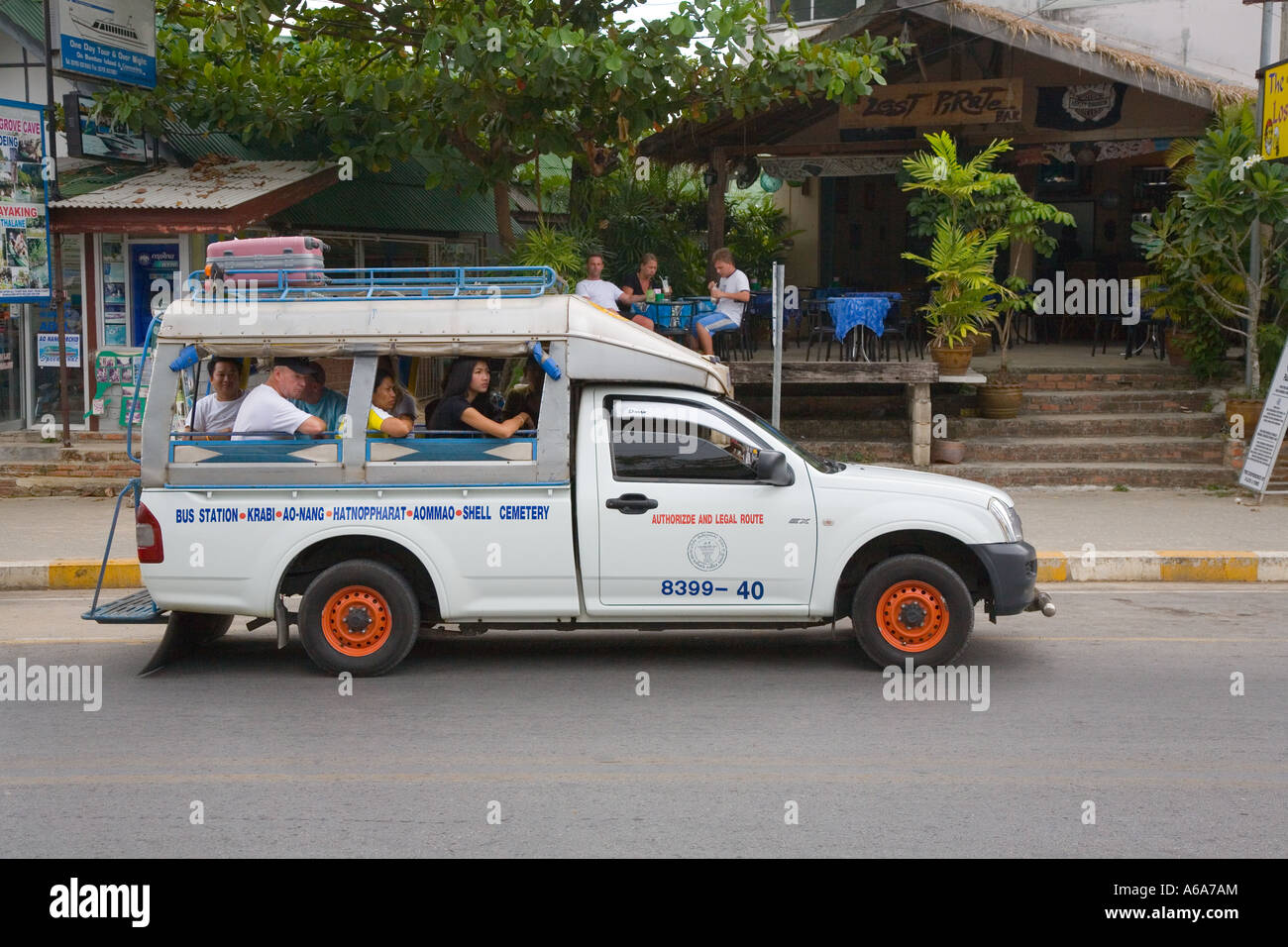 Converted flat van or Songtaews carry local and tourist passengers ...