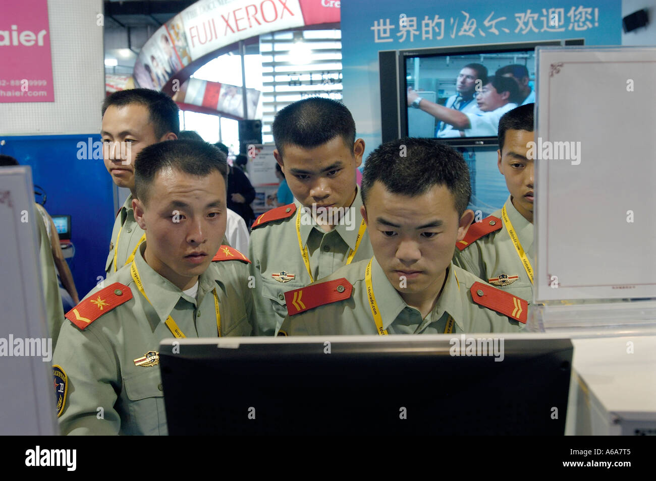PLA men use Haier computers in International High-tech expo in Beijing ...