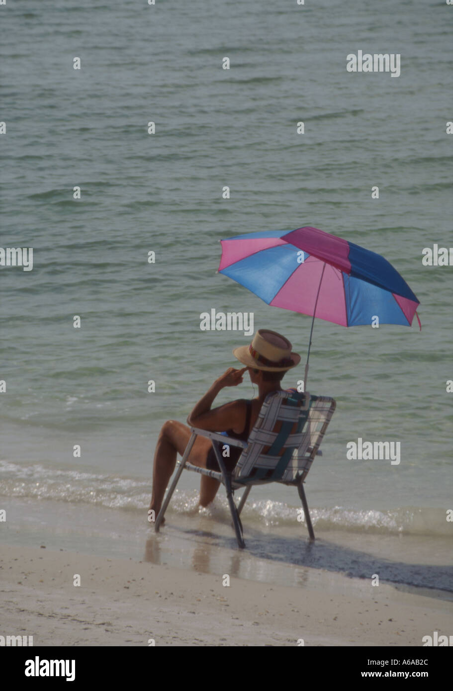 Woman in beach chair Stock Photo - Alamy