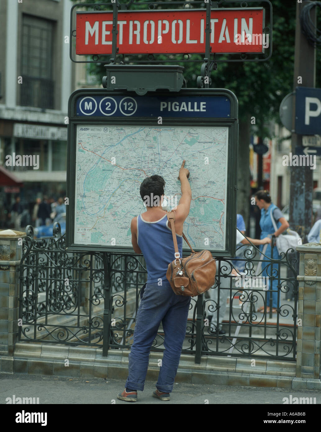 male tourist checking Metro map in Paris France Stock Photo - Alamy