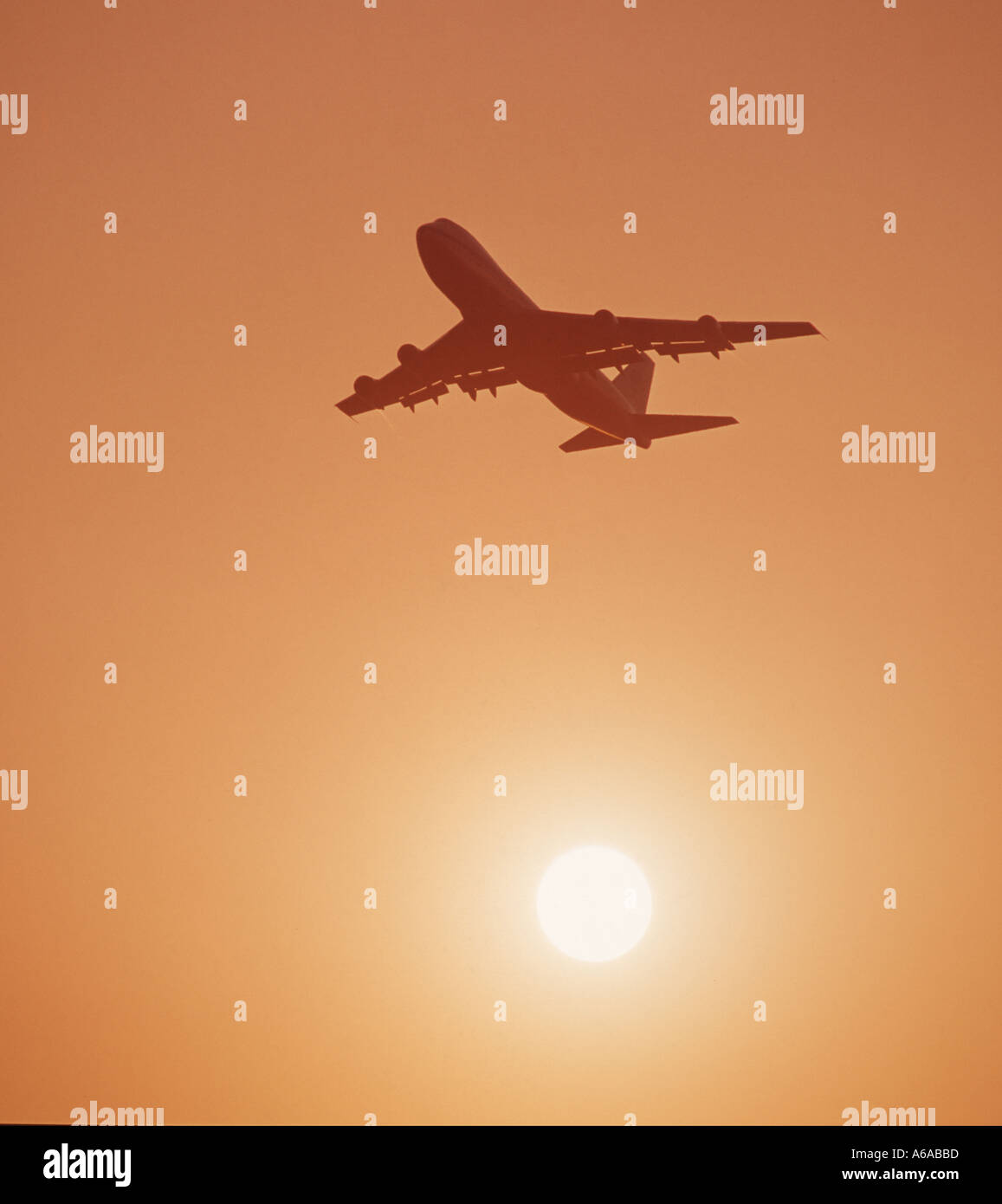 commercial jet airplane taking off at sunset Stock Photo - Alamy