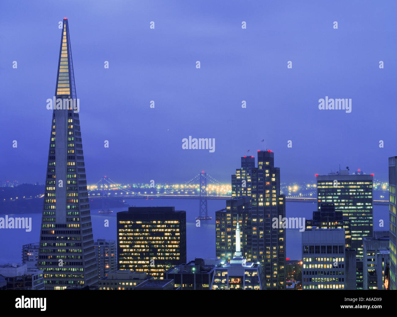 Transamerica Pyramid and Oakland Bay Bridge with San Francisco skyline ...