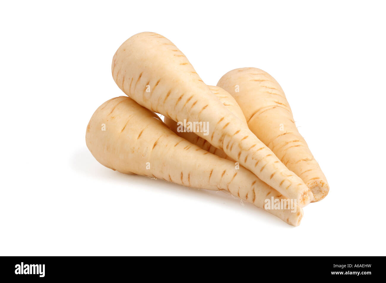 Parsnips on white background Stock Photo - Alamy