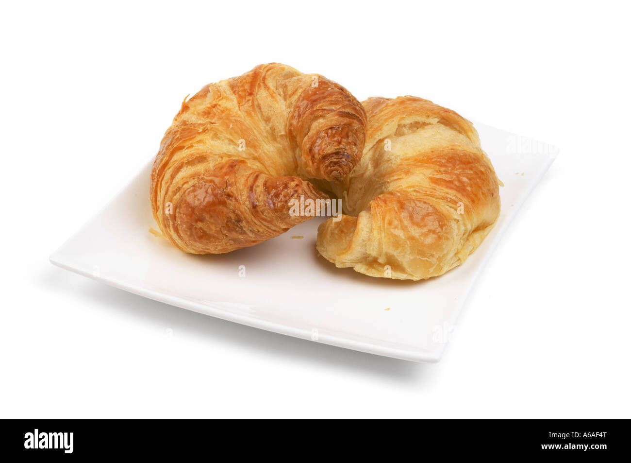 Two croissant on plate Stock Photo - Alamy
