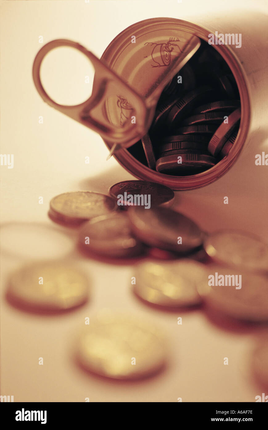 Coins in Tin Can Stock Photo - Alamy