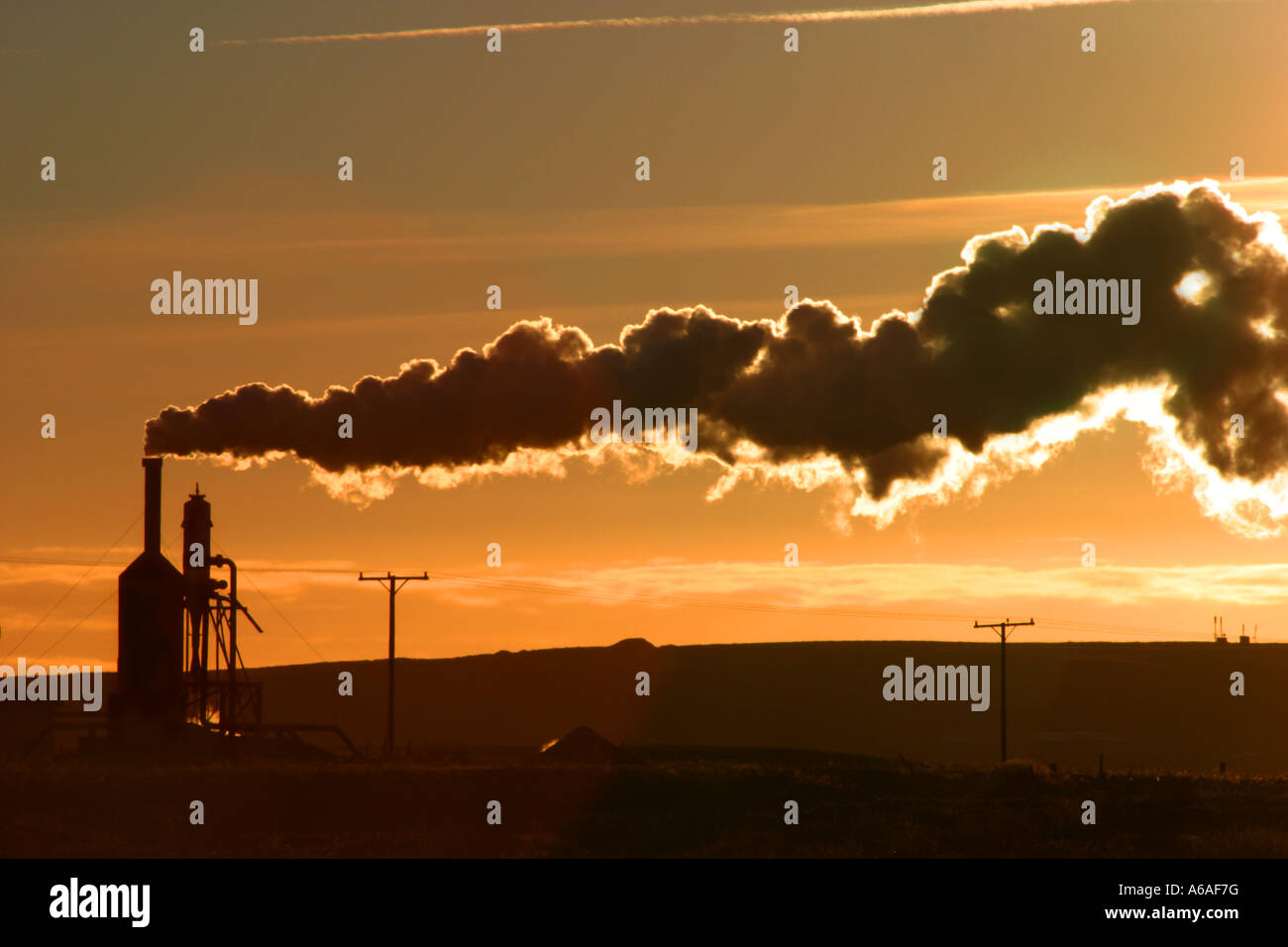 Silhouette buildings smoke sunset hi-res stock photography and images ...