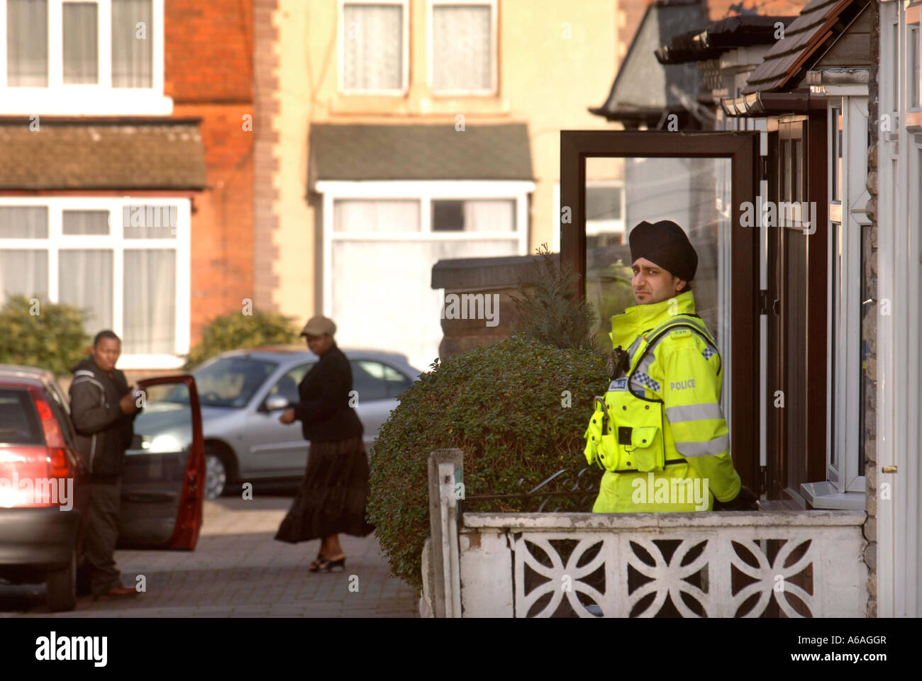 A POLICEMAN GUARDING A HOUSE IN BIRMINGHAM AFTER A SERIES OF TERRORISM ...