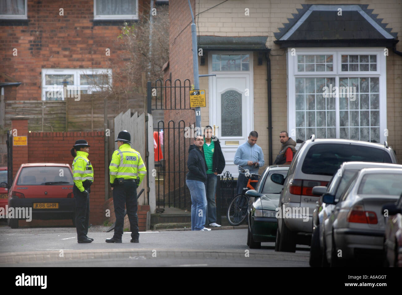 A POLICEMAN AND POLICEWOMAN GUARDING IN BIRMINGHAM AFTER A SERIES OF ...