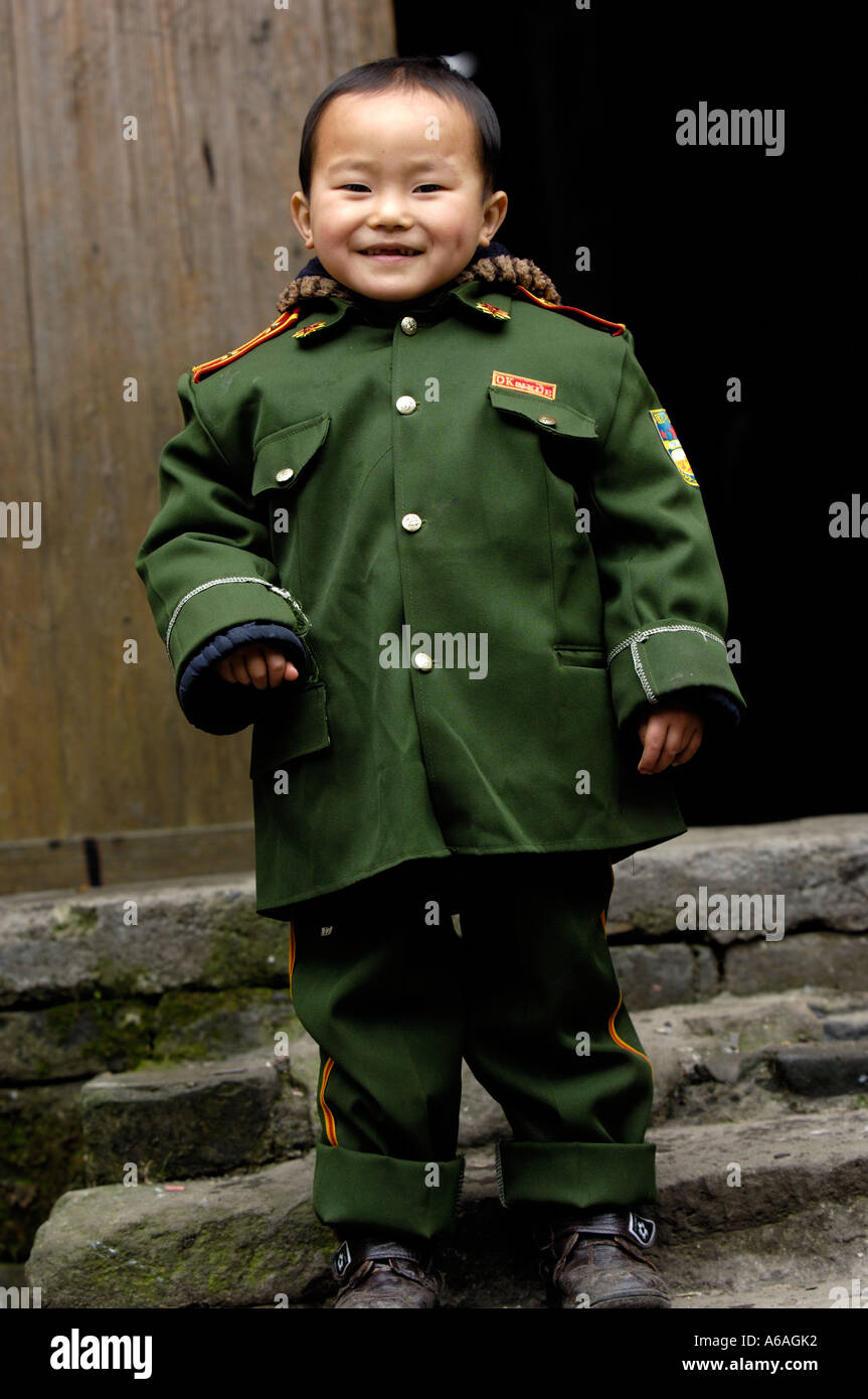 Little boy dressed as soldier by parents in in Liukeng, a 1000 year old ...