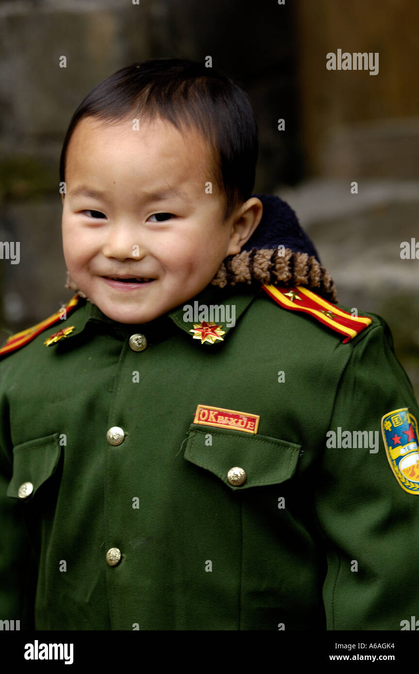 Little boy dressed as soldier by parents in in Liukeng, a 1000 year old ...
