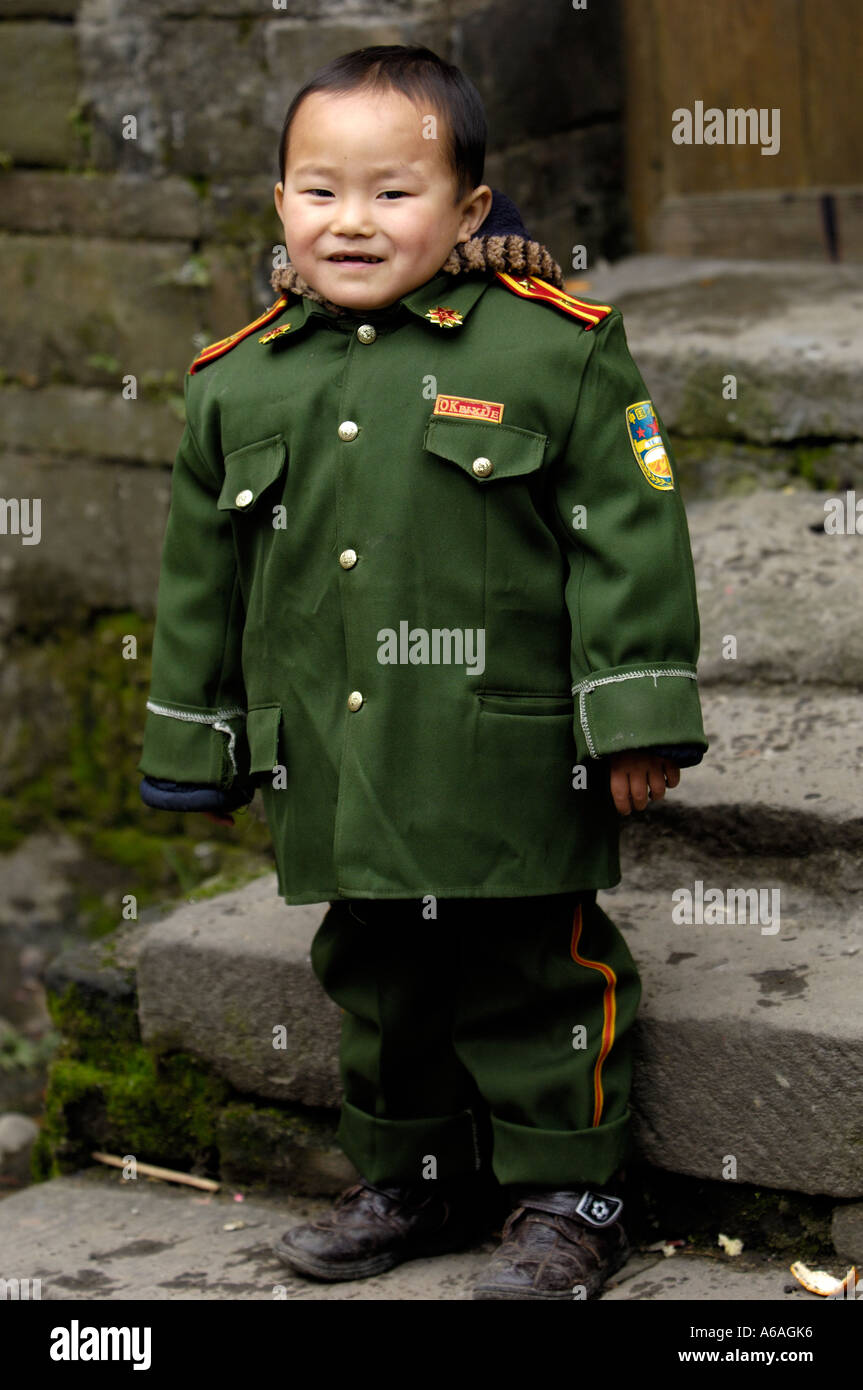 Little boy dressed as soldier by parents in in Liukeng, a 1000 year old ...