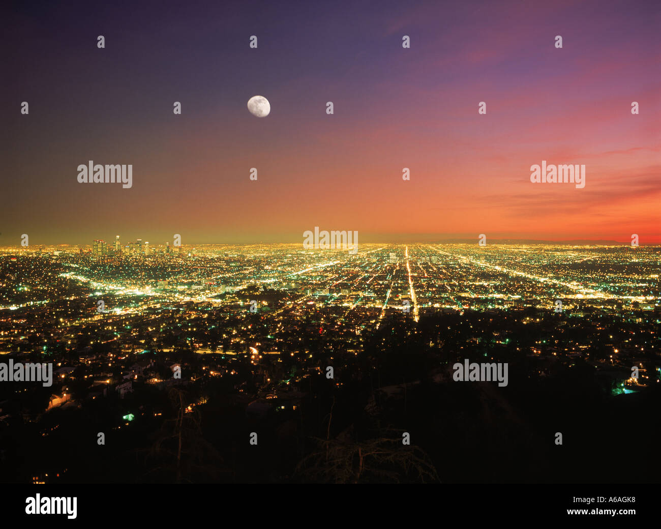 Los Angeles urban sprawl under rising moon at dusk from Griffith Park ...