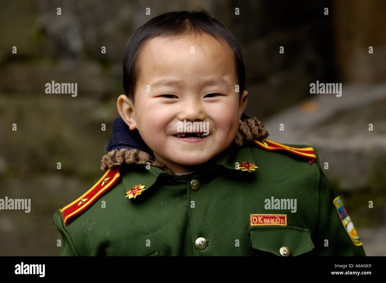 Little boy dressed as soldier by parents in in Liukeng, a 1000 year old ...