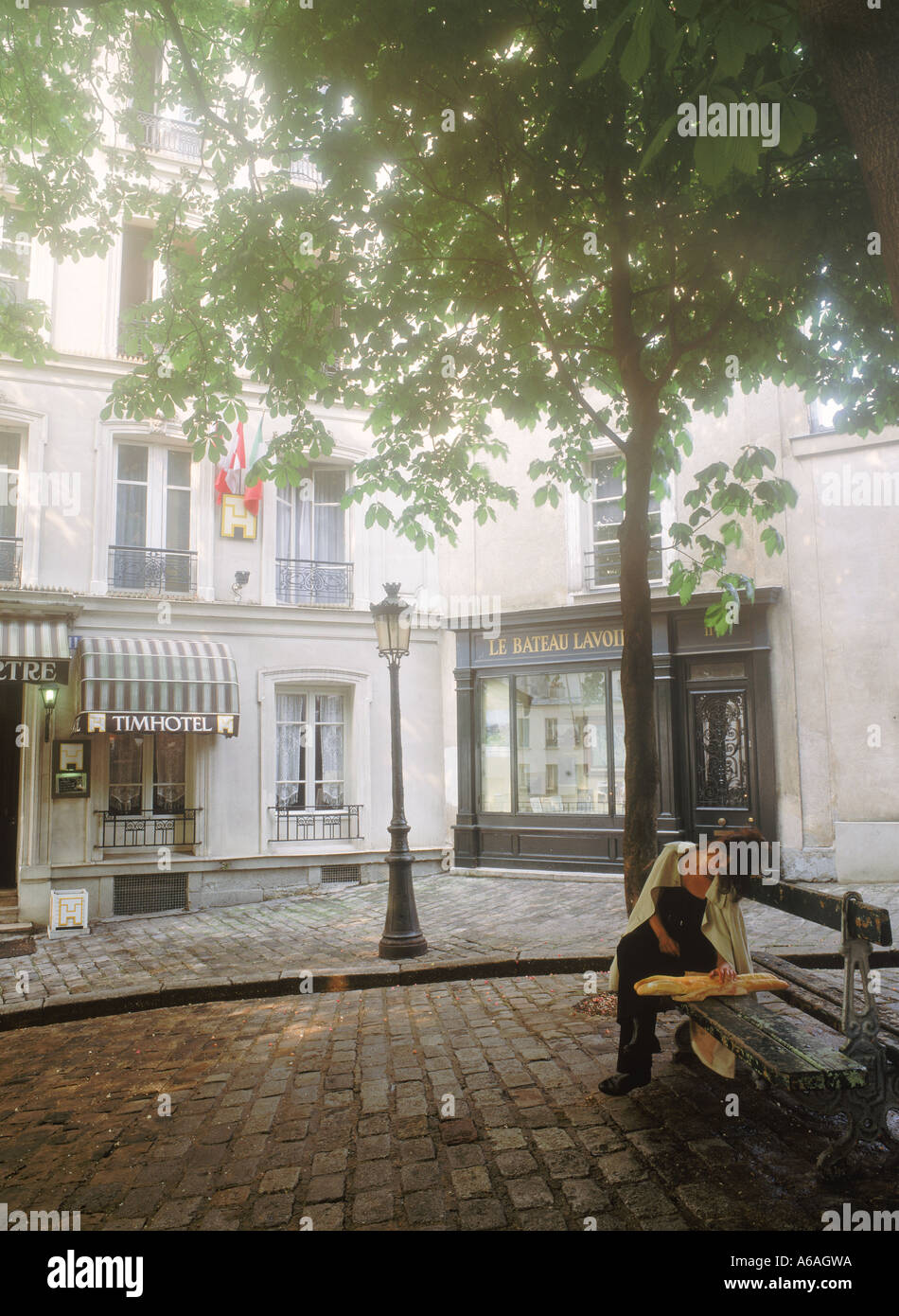 Female baguette paris sitting bench hi-res stock photography and images ...