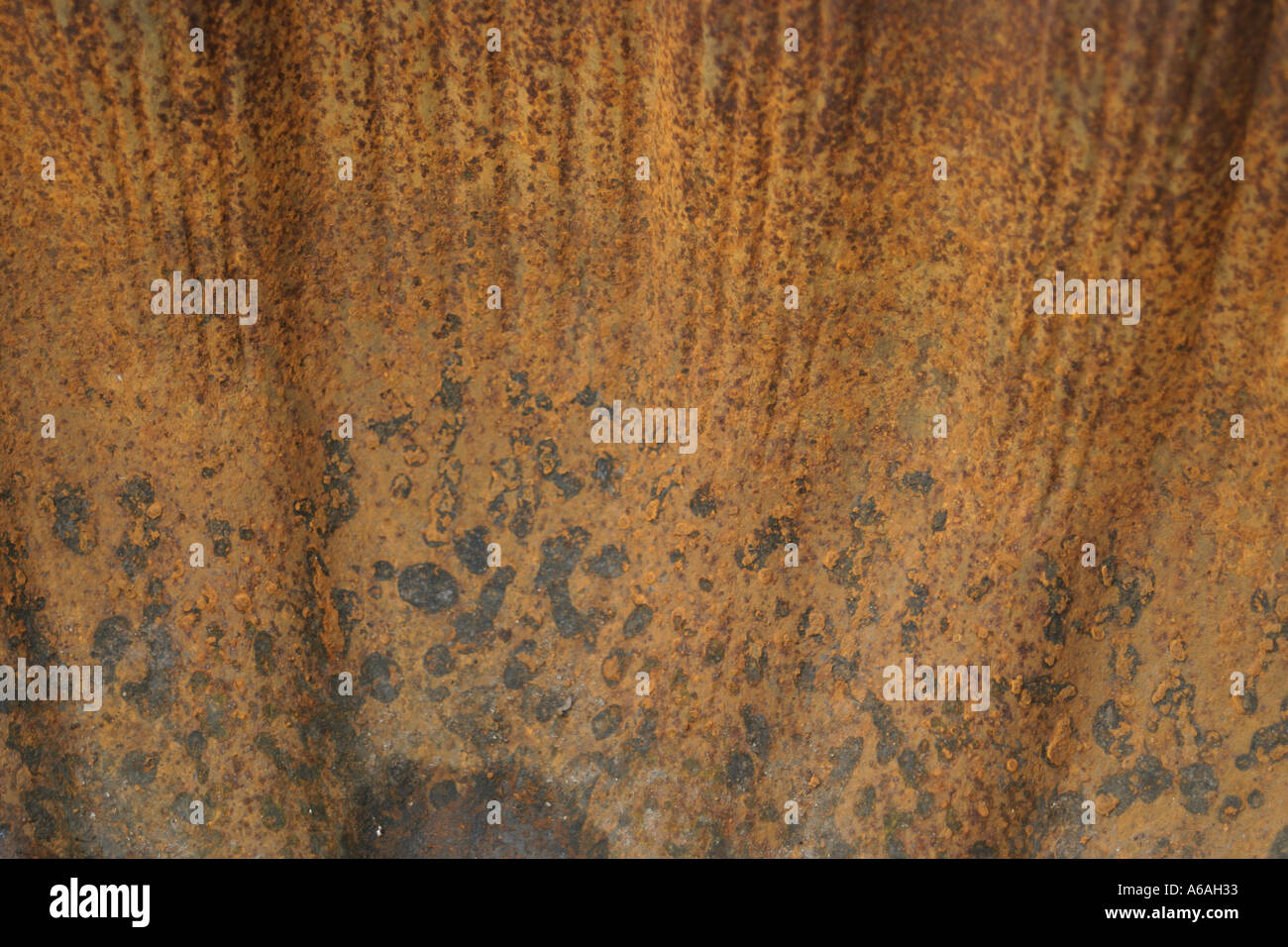 orange and grey oxidation pattern on massive planter Stock Photo - Alamy