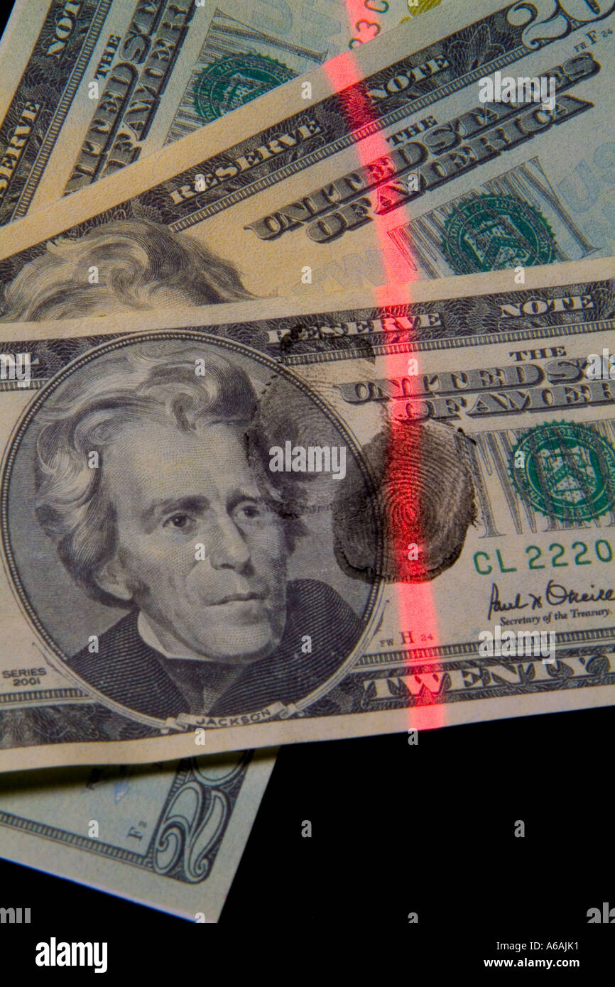 Laser scanning fingerprint on currency Stock Photo - Alamy