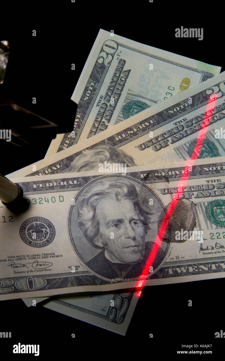 Laser scanning fingerprint on currency Stock Photo - Alamy